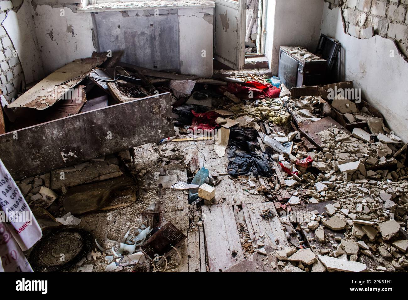 Interior of a house destroyed by a Russian bombardment. Objects of ...