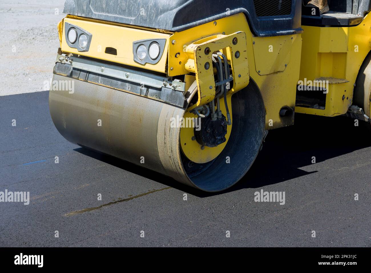 Construction worker in vibratory road roller compactor machine operator ...