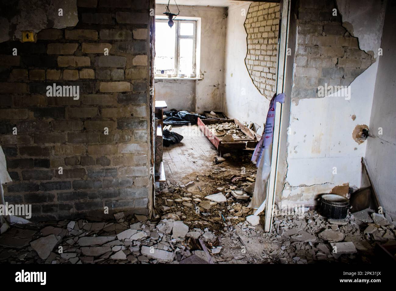 Interior of a house destroyed by a Russian bombardment. Objects of ...
