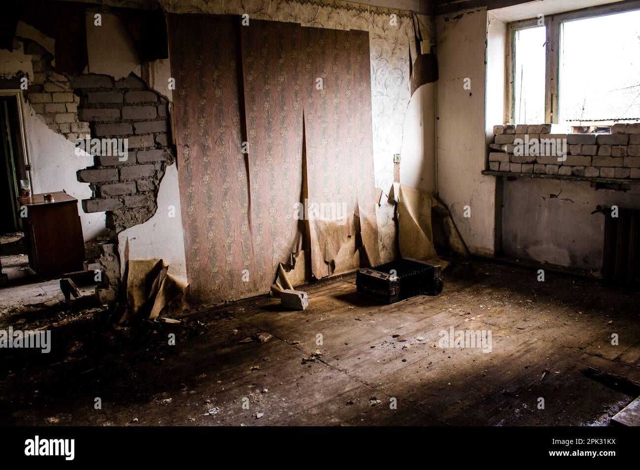Interior of a house destroyed by a Russian bombardment. Objects of ...
