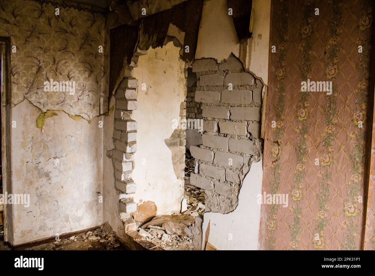 Interior of a house destroyed by a Russian bombardment. Objects of ...