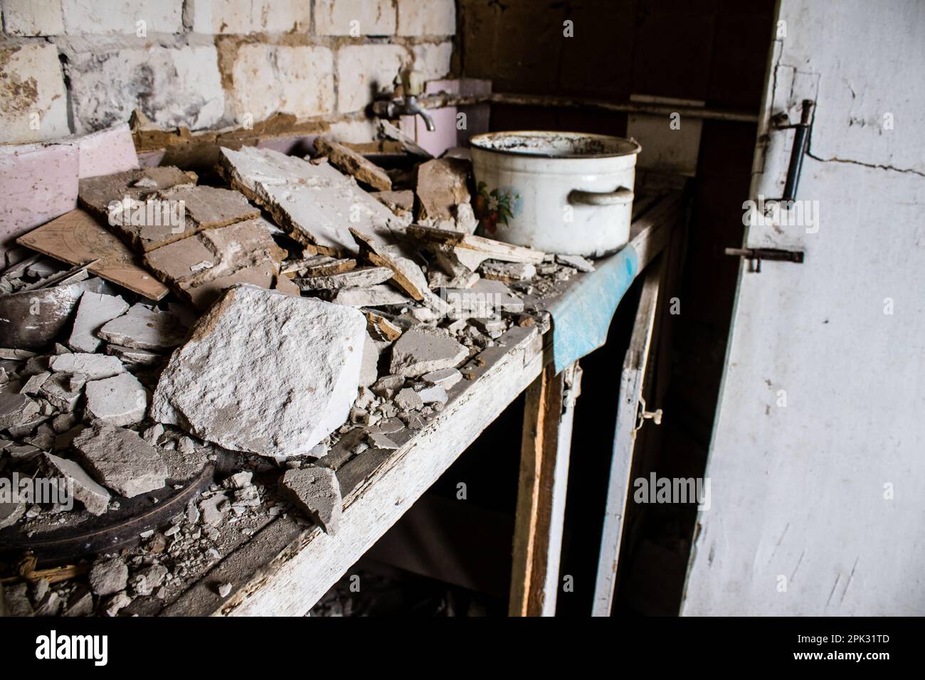 Interior of a house destroyed by a Russian bombardment. Objects of ...