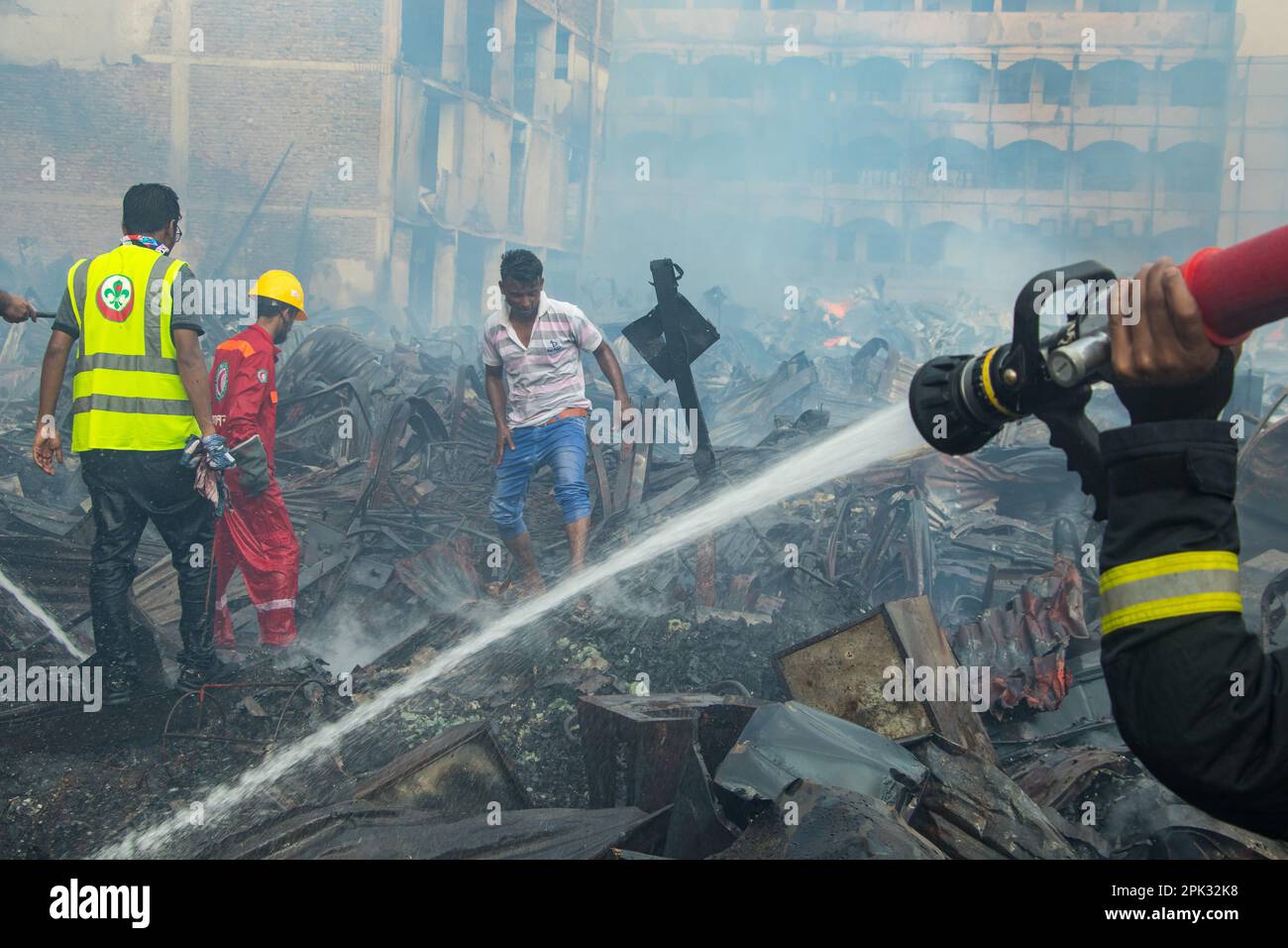 Dhaka, Bangladesh. 04th Apr, 2023. Firefighters work to control a major ...