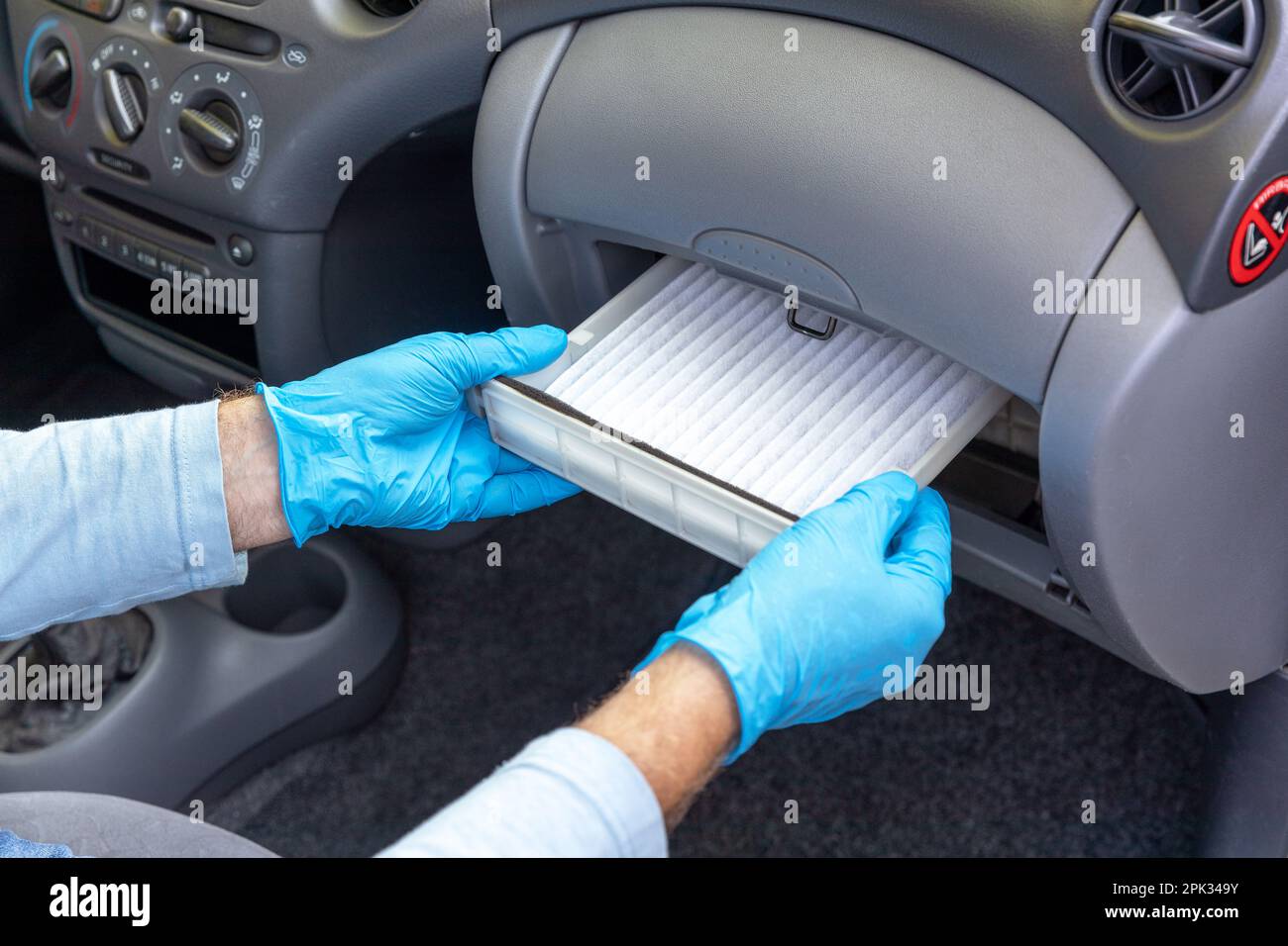 Replacing cabin pollen air filter for vehicle Stock Photo - Alamy
