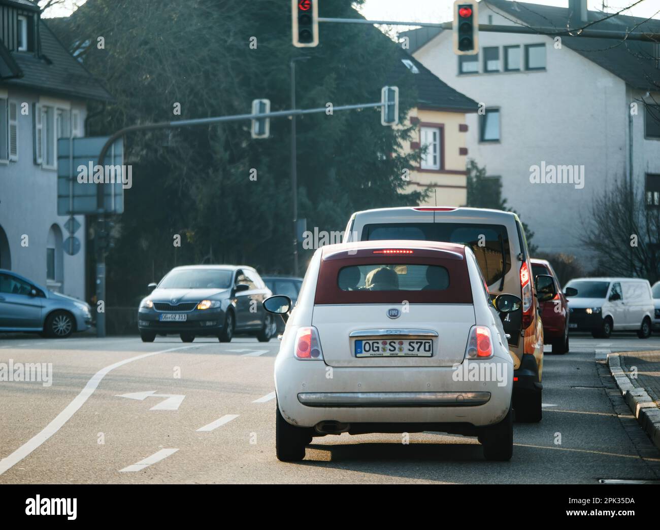 Germany - February 10, 2023: A white Fiat 500 waits at a stoplight on a ...