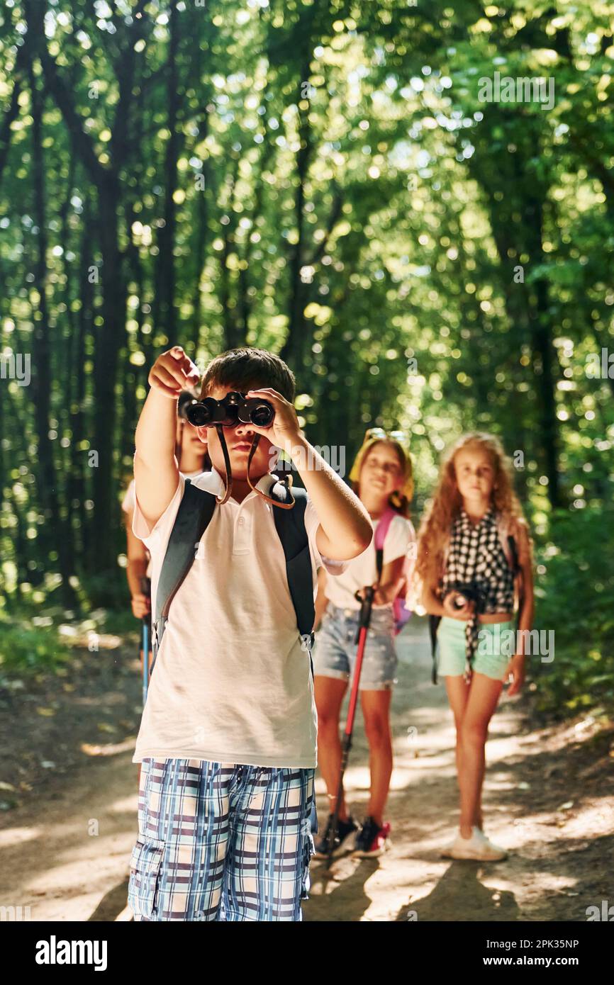 Beautiful nature. Kids strolling in the forest with travel equipment ...