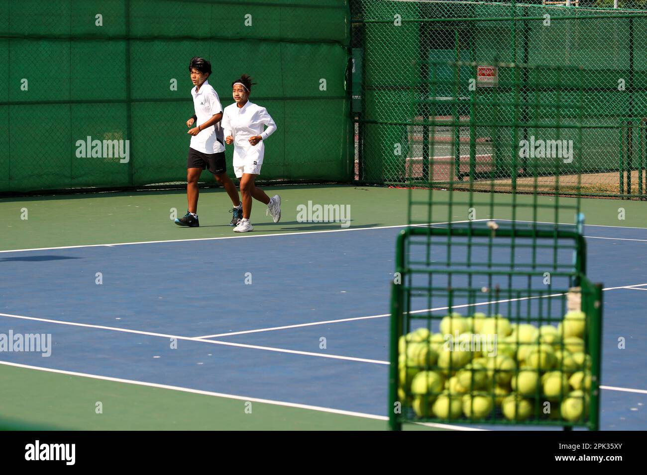 Yangon, Myanmar. 5th Apr, 2023. Myanmar's tennis athletes run during a ...