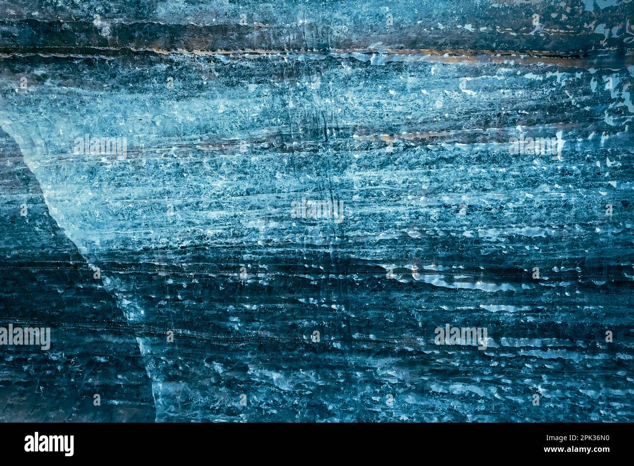 Dark black and grey volcanic ash and rock particles trapped in semi ...