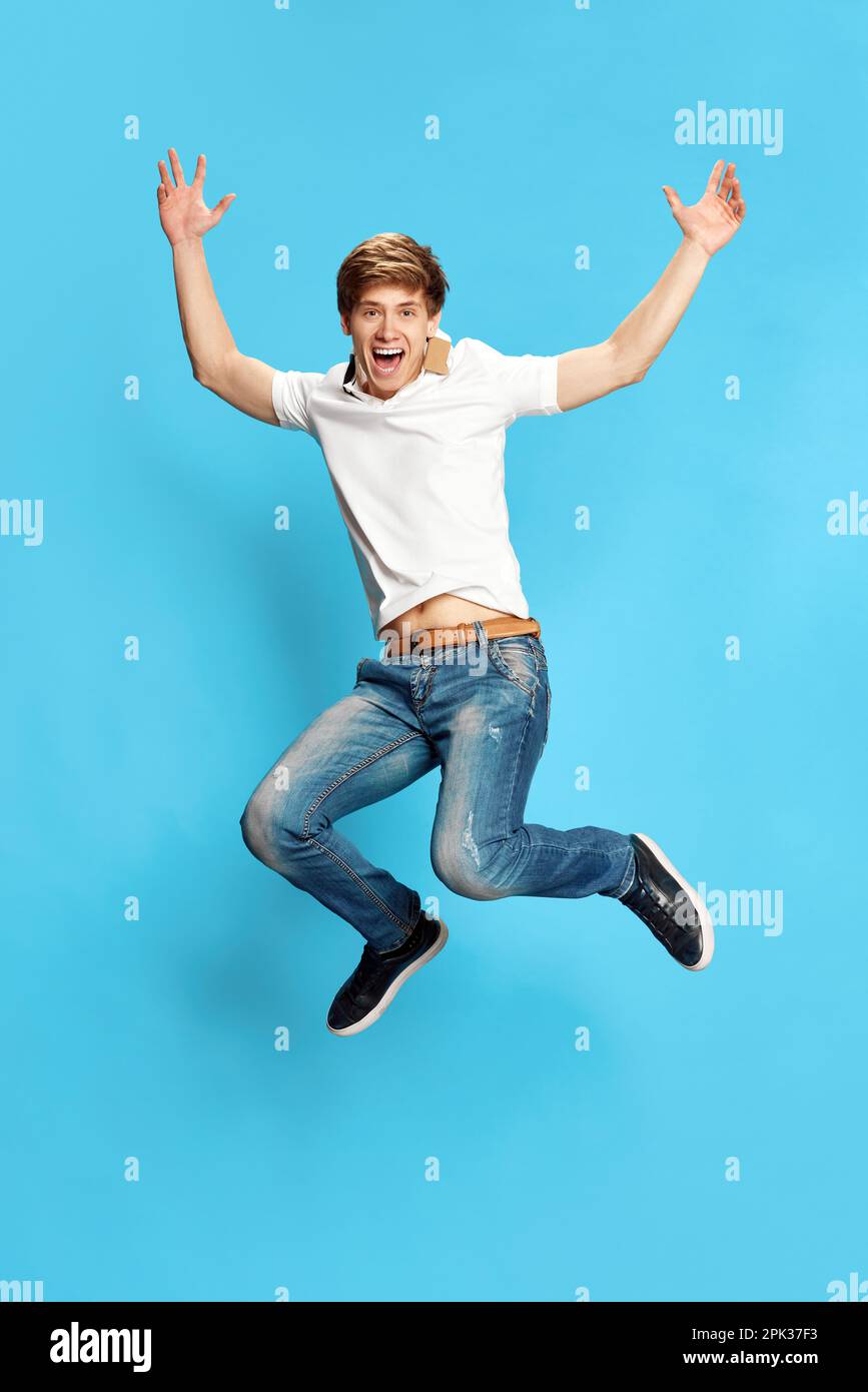 Full-length image of young happy, delightful, smiling man in casual ...