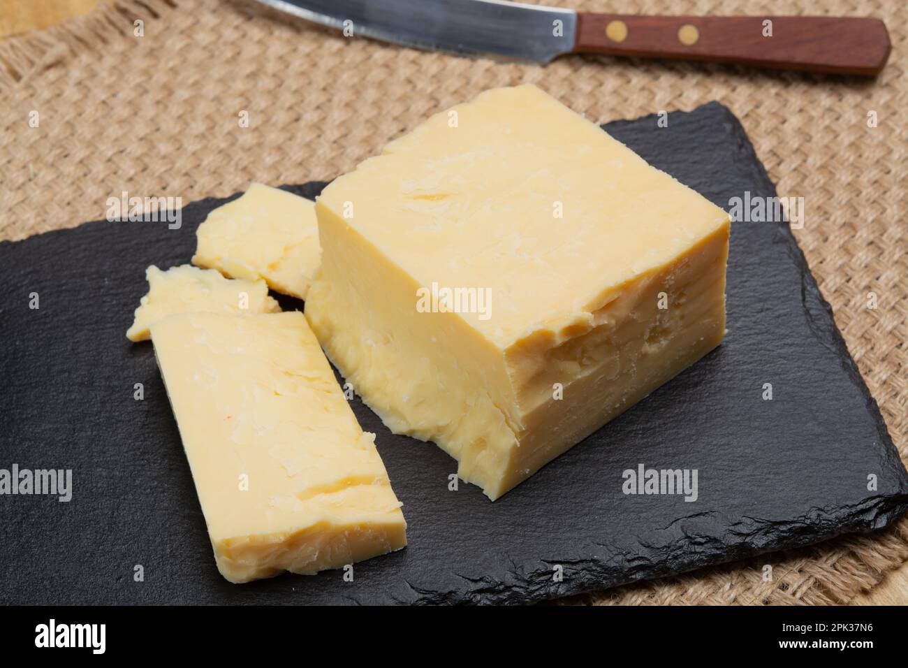 British cheeses collection, English matured smoked cheddar cheese close ...