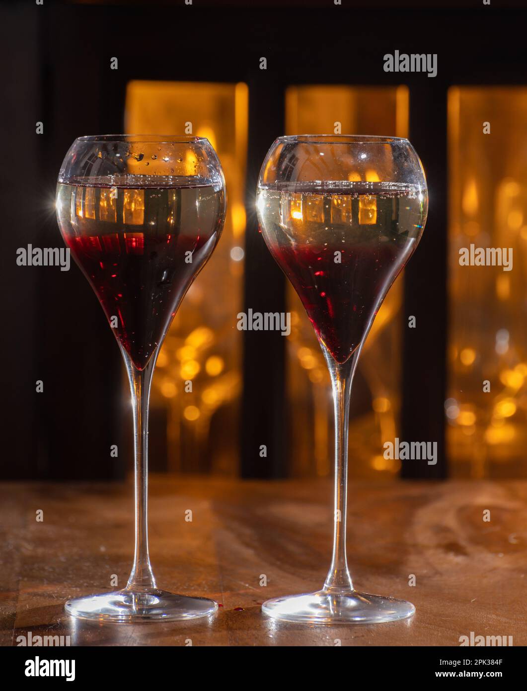 Drinking of Kir Royal, French aperitif cocktail made from creme de ...