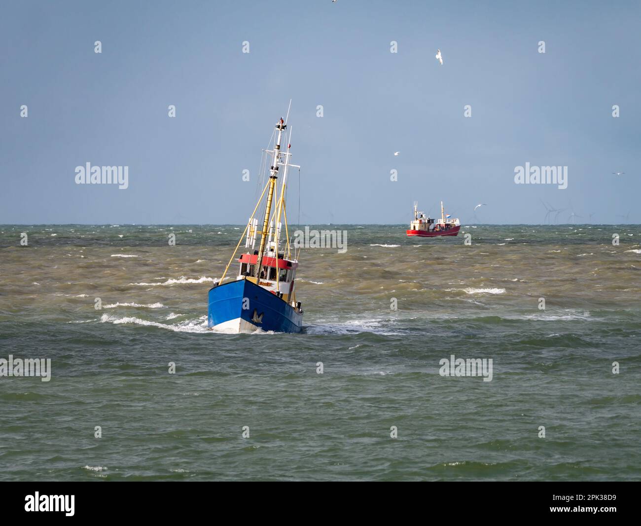 Small fishing boat in waves at entrance of Scheveningen harbour, The ...