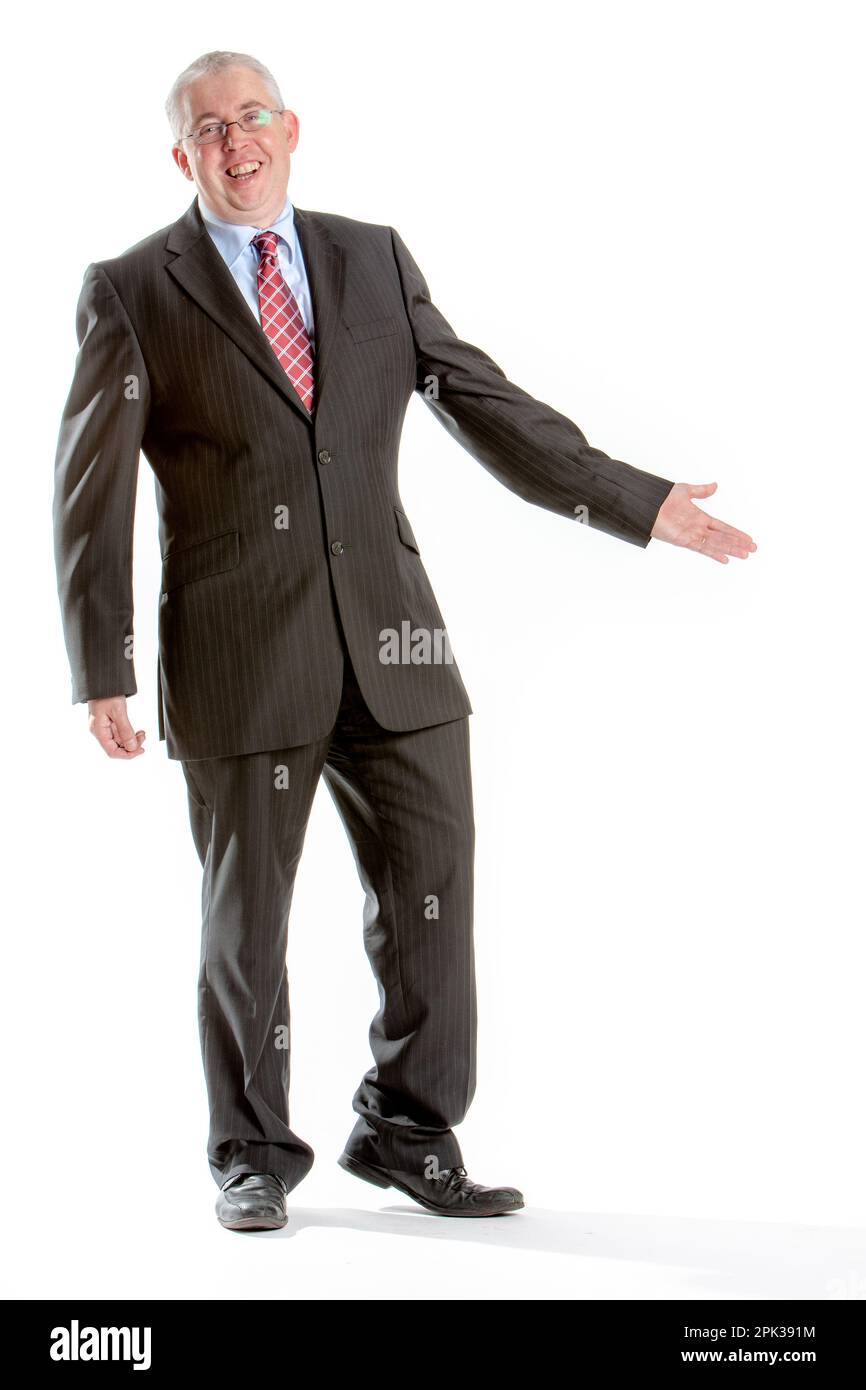 Business Colleagues: Sales Professional. A friendly man presenting to ...