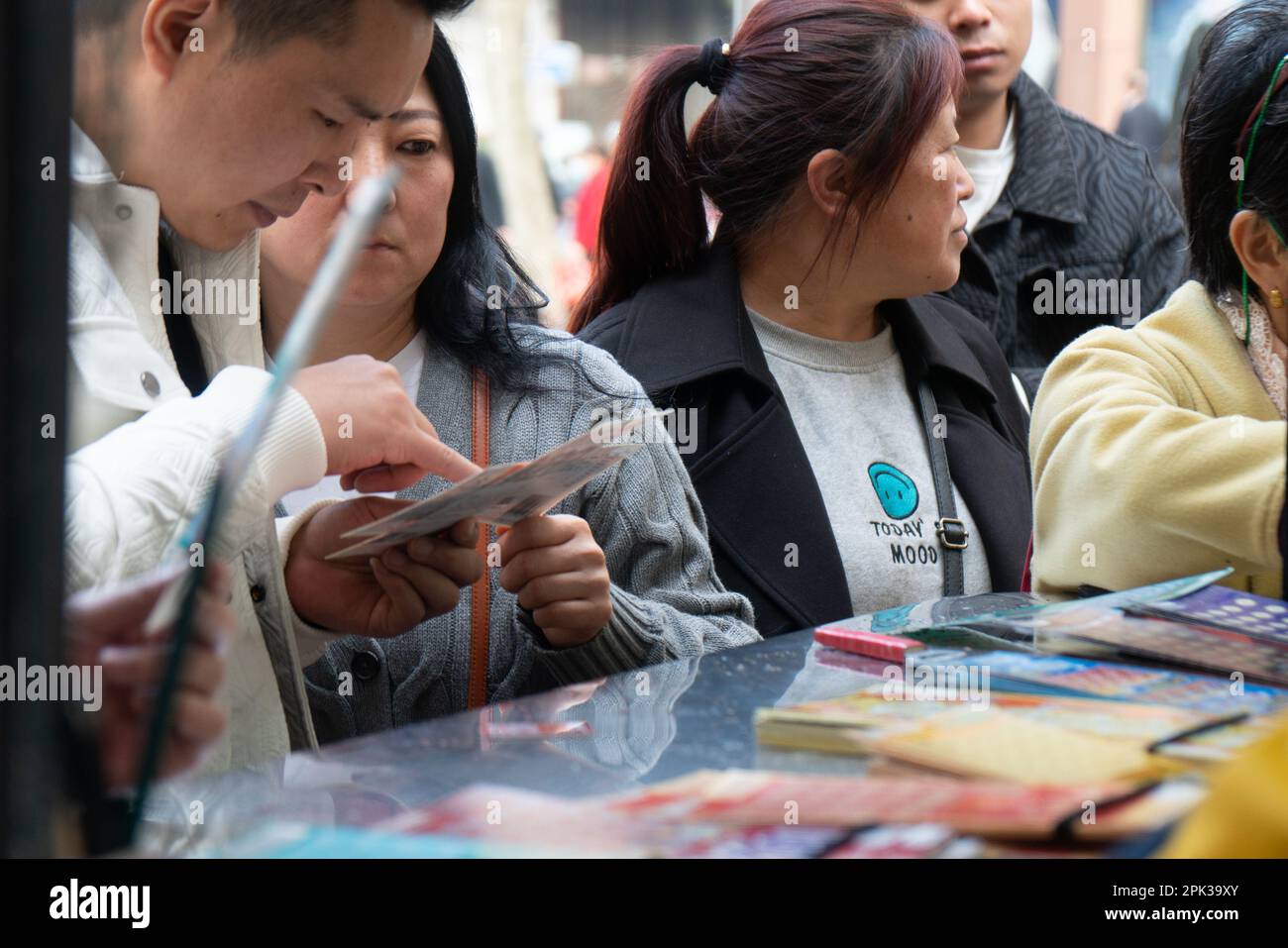 SHANGHAI, CHINA - APRIL 5, 2023 - Visitors buy lottery tickets and draw ...