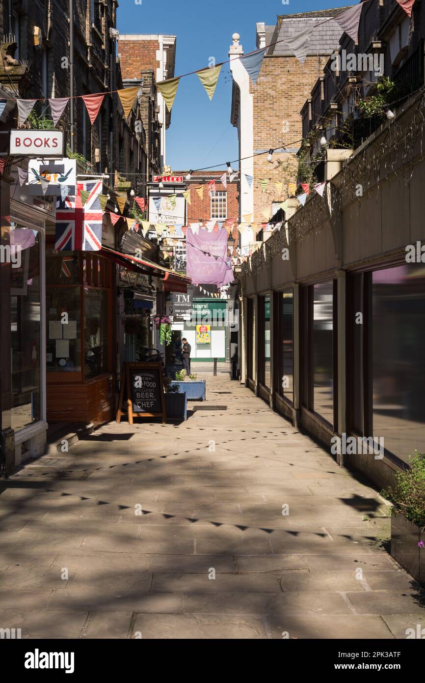 Closeup of colourful bunting and Angel & Crown pub sign on Church Court ...