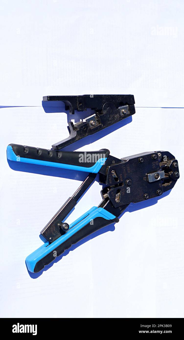 Ethernet cable Crimping tools on a white background Stock Photo - Alamy