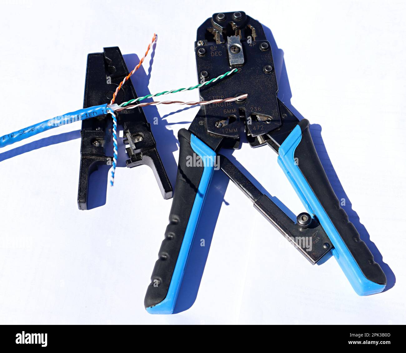 Ethernet cable Crimping tools on a white background Stock Photo - Alamy