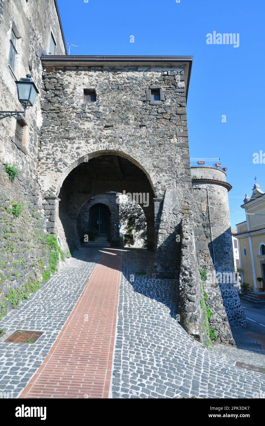 A narrow street among the old houses of Pofi, a medieval town in the ...