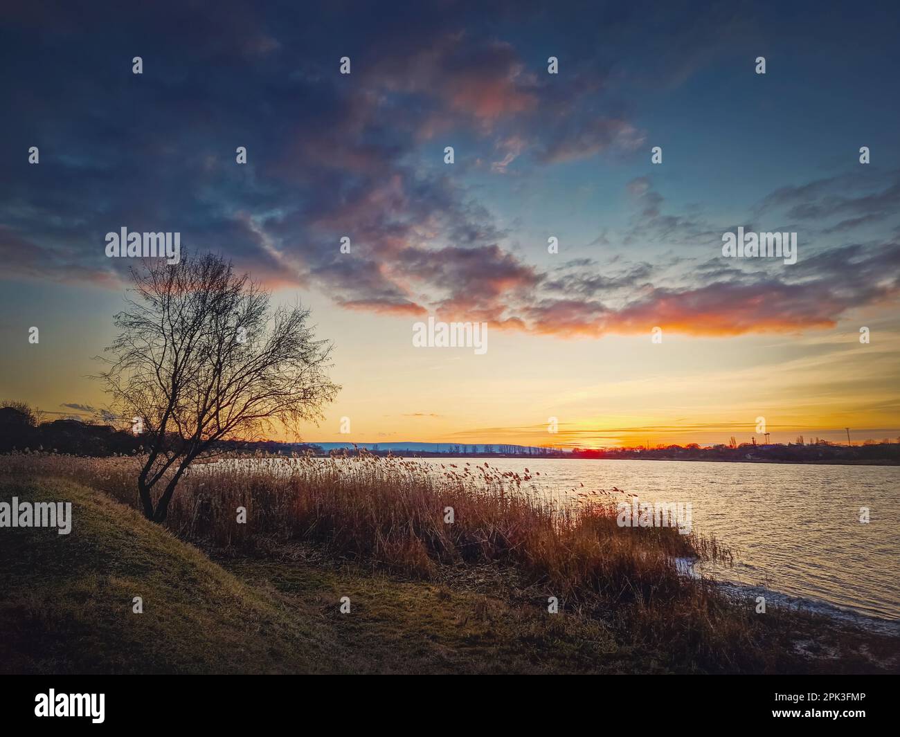 Scenic sunset over lake colorful hi-res stock photography and images ...