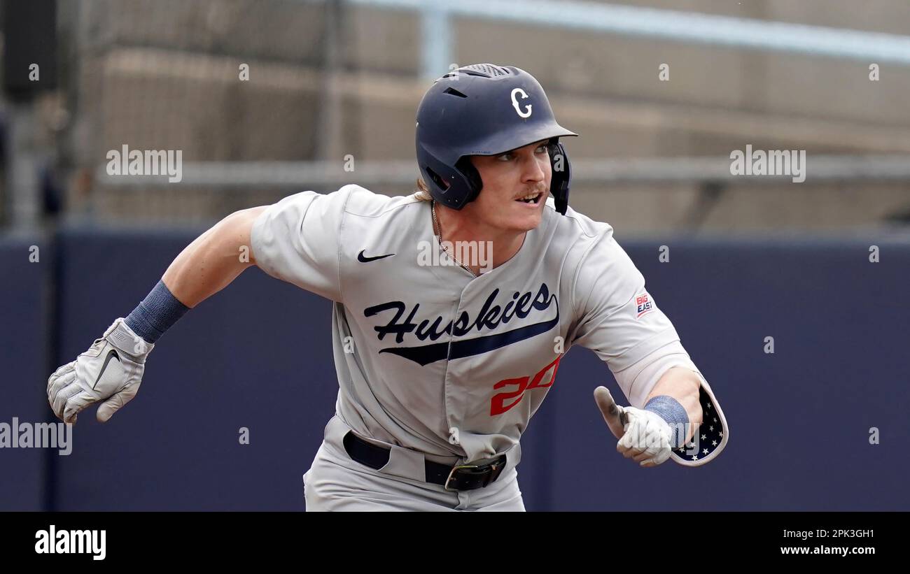 UConn third baseman Luke Broadhurst (20) sprints to first during an ...