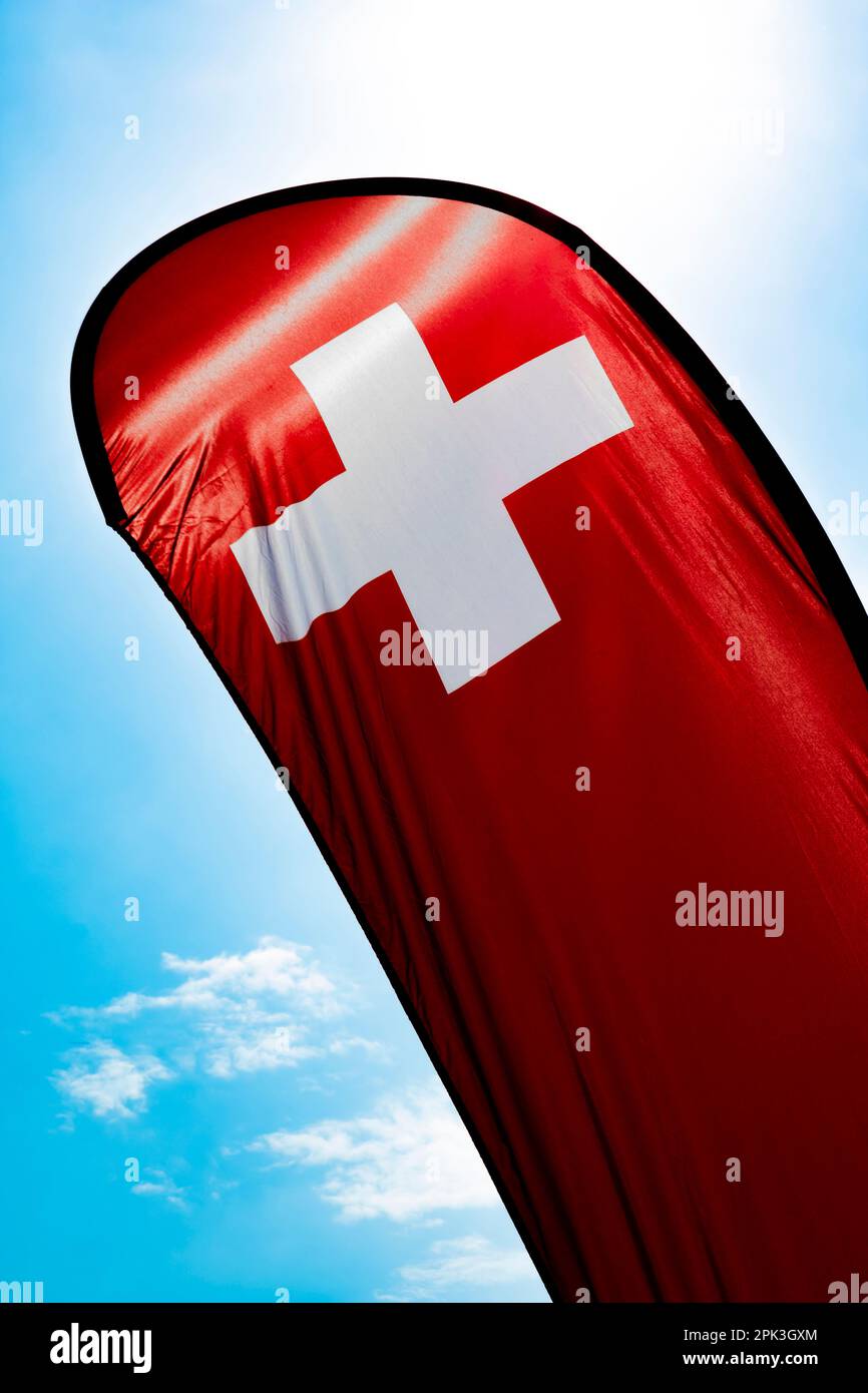 Swiss Banner Flag with Sunlight in Switzerland Stock Photo - Alamy