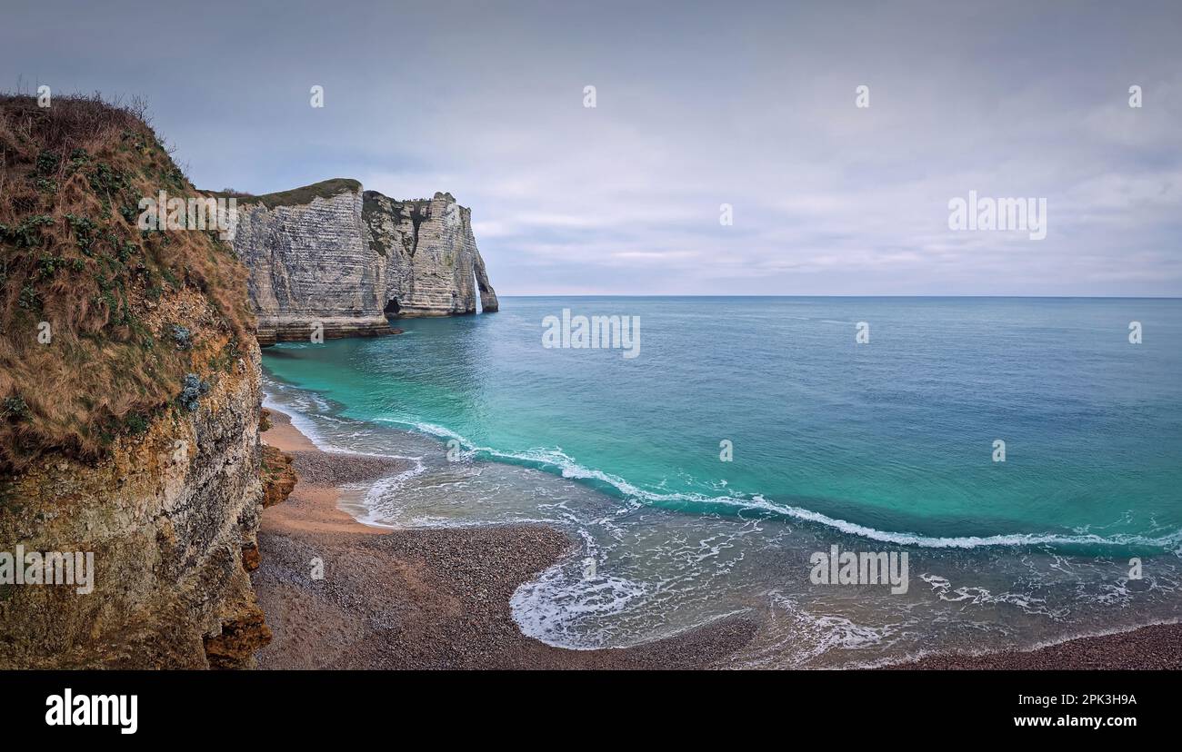 Sightseeing view to the wonderful cliffs of Etretat washed by the waves ...