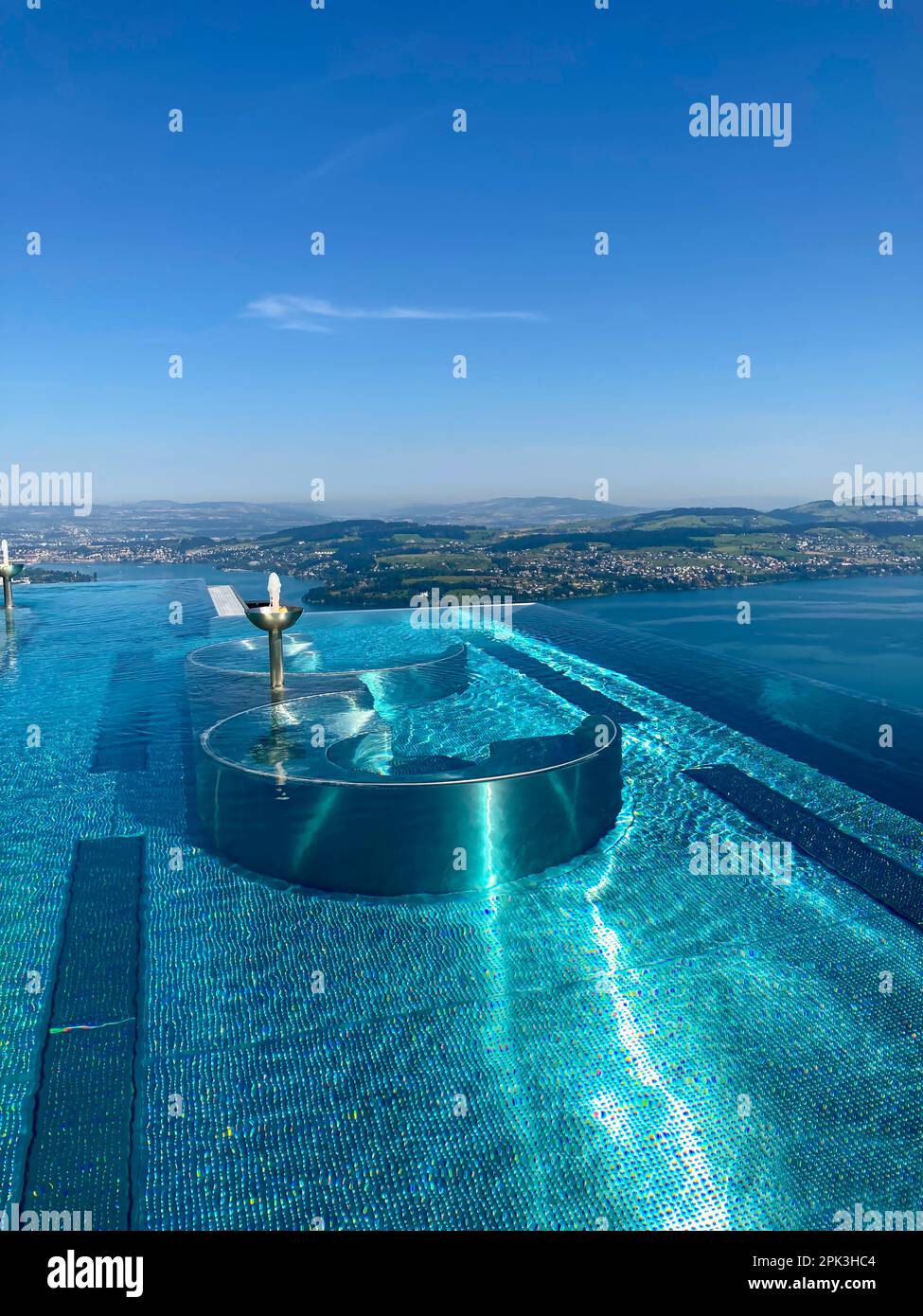Infinity Swimming Pool with Mountain and Lake Lucerne View in a Sunny ...
