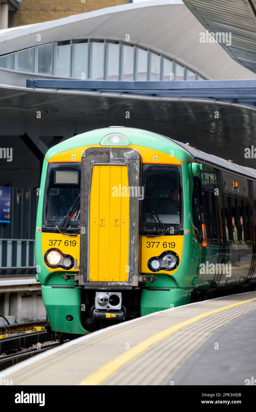 Southern train waiting at a railway station, England Stock Photo - Alamy