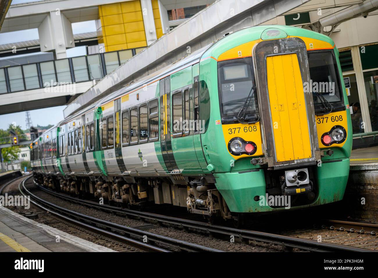 Southern train waiting at a railway station, England Stock Photo - Alamy