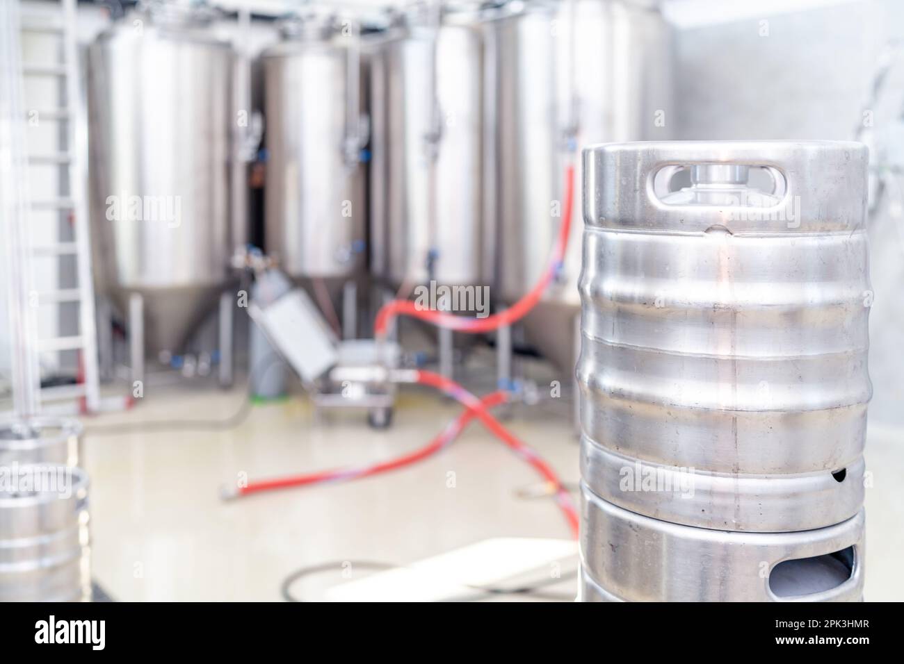 beer barrels with beer in a brewery Stock Photo - Alamy