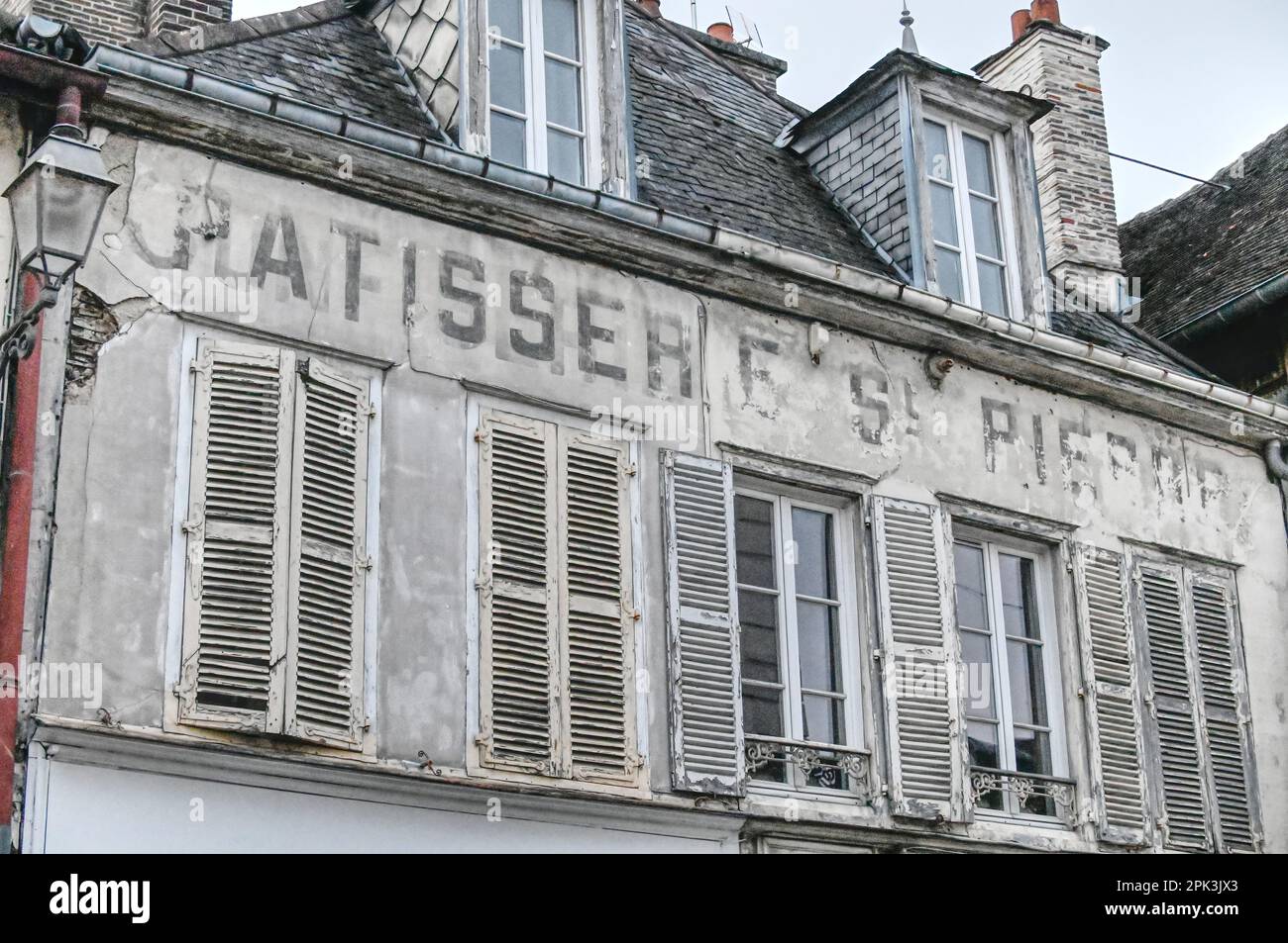 A ghost sign, an old painted sign, on a building in the centre of ...