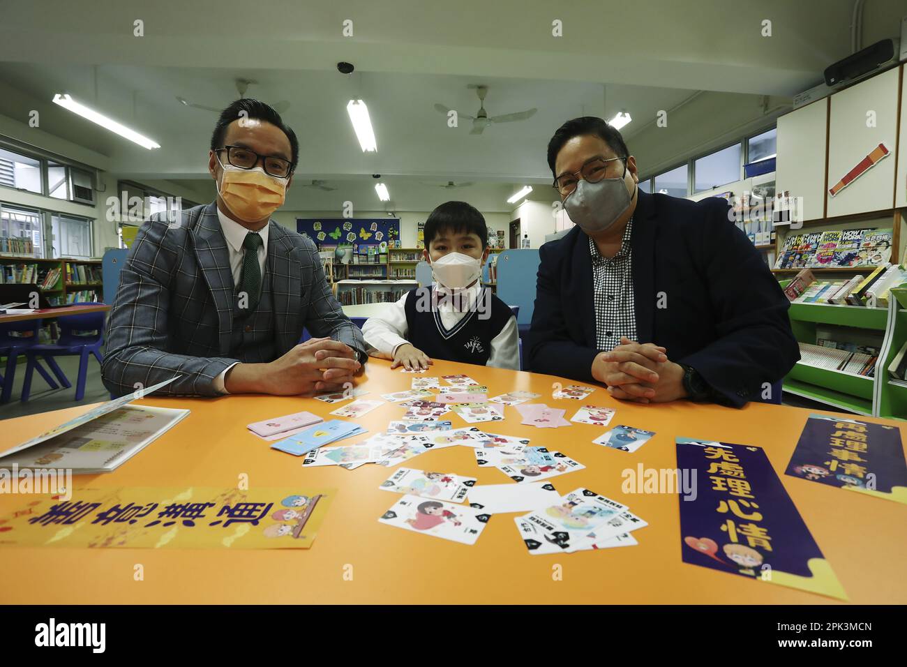 (L to R) Tak Sun School principal Kwok Chiu Kwan, with student Colin Choi, and father Michael ...