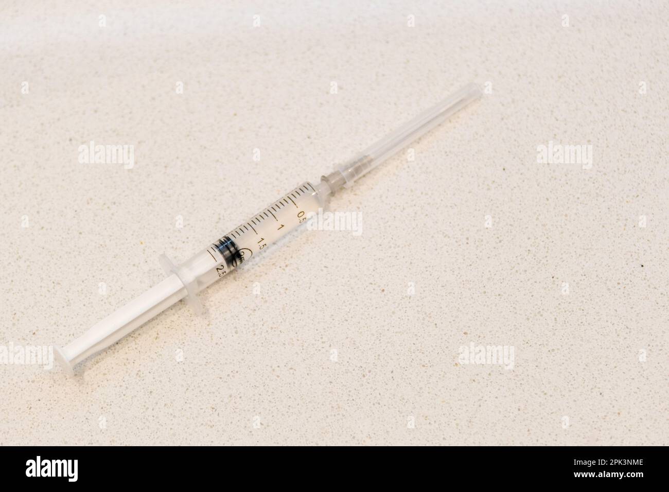 Close up needle syringe on white ground. Selective close of needle ...