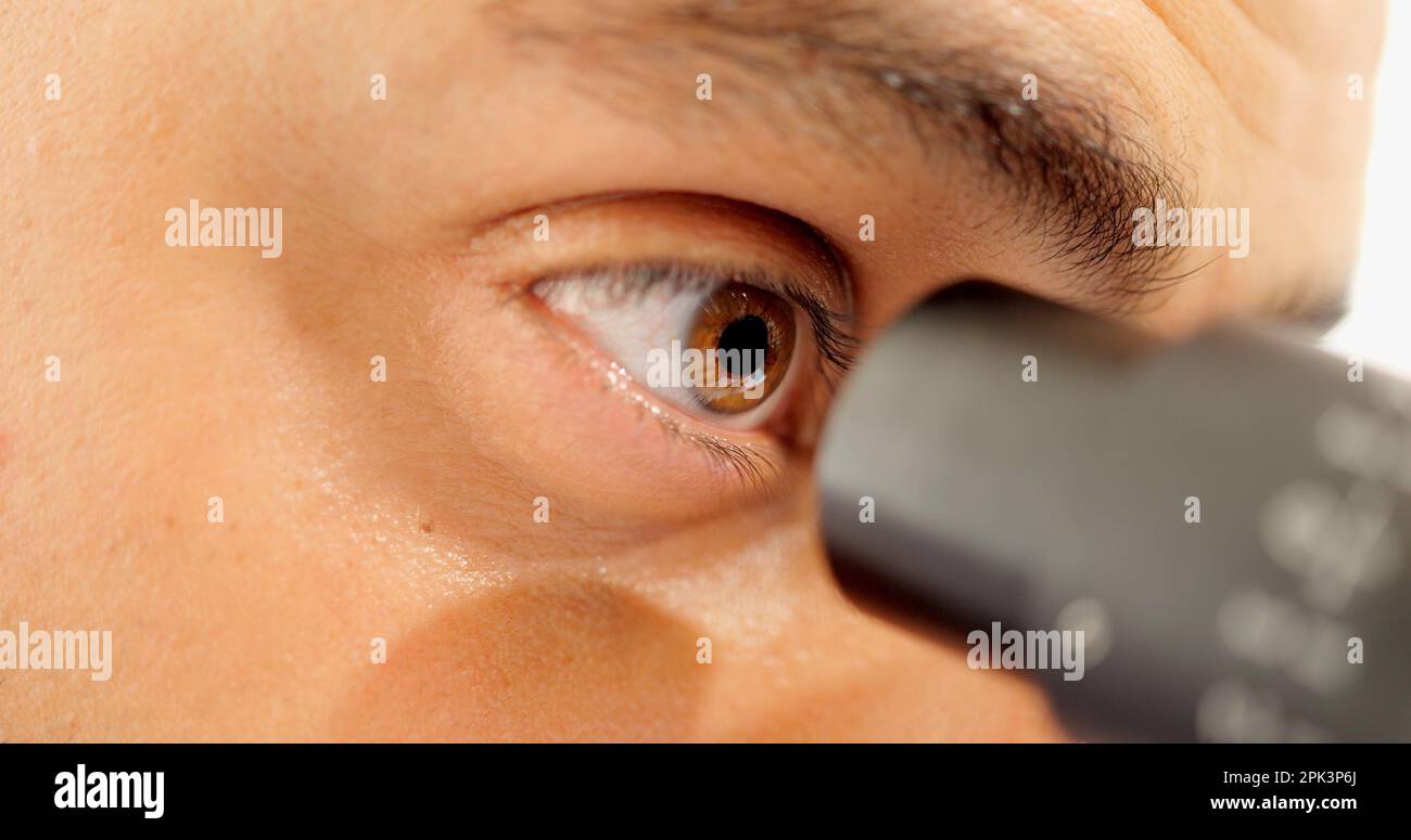 Closeup woman looking through microscope hi-res stock photography and ...