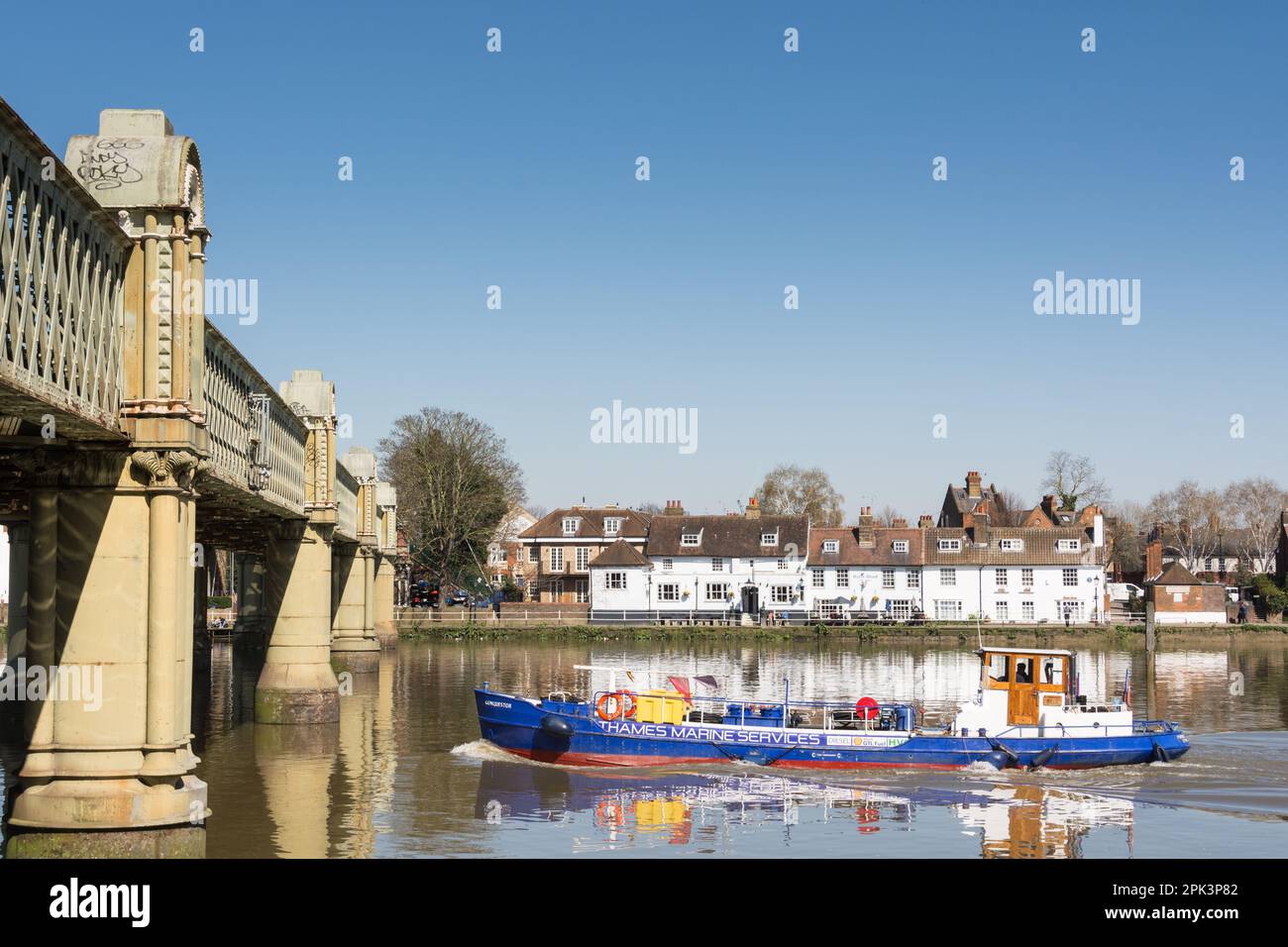 A Thames Marine Services boat passing the Bull's Head Public House and ...