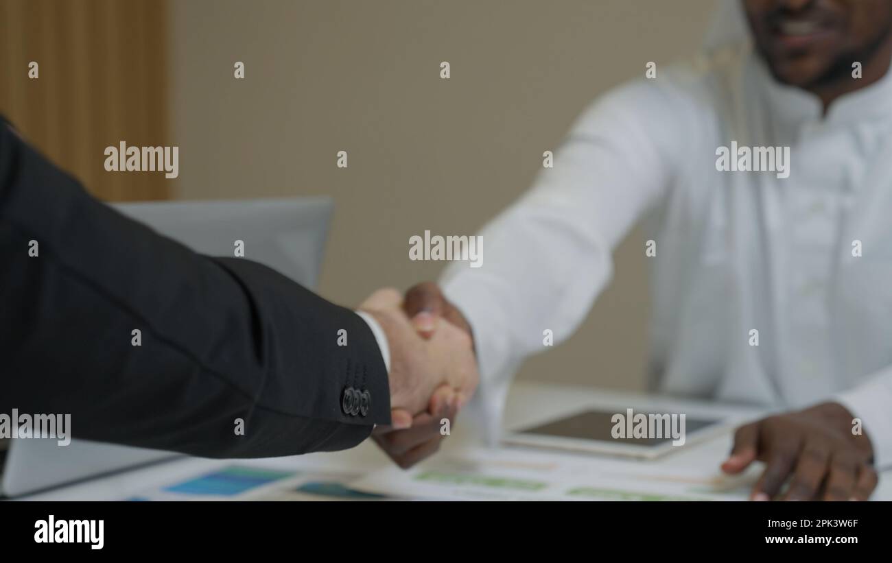 Businessmen shacking hands together showing successful contract ...