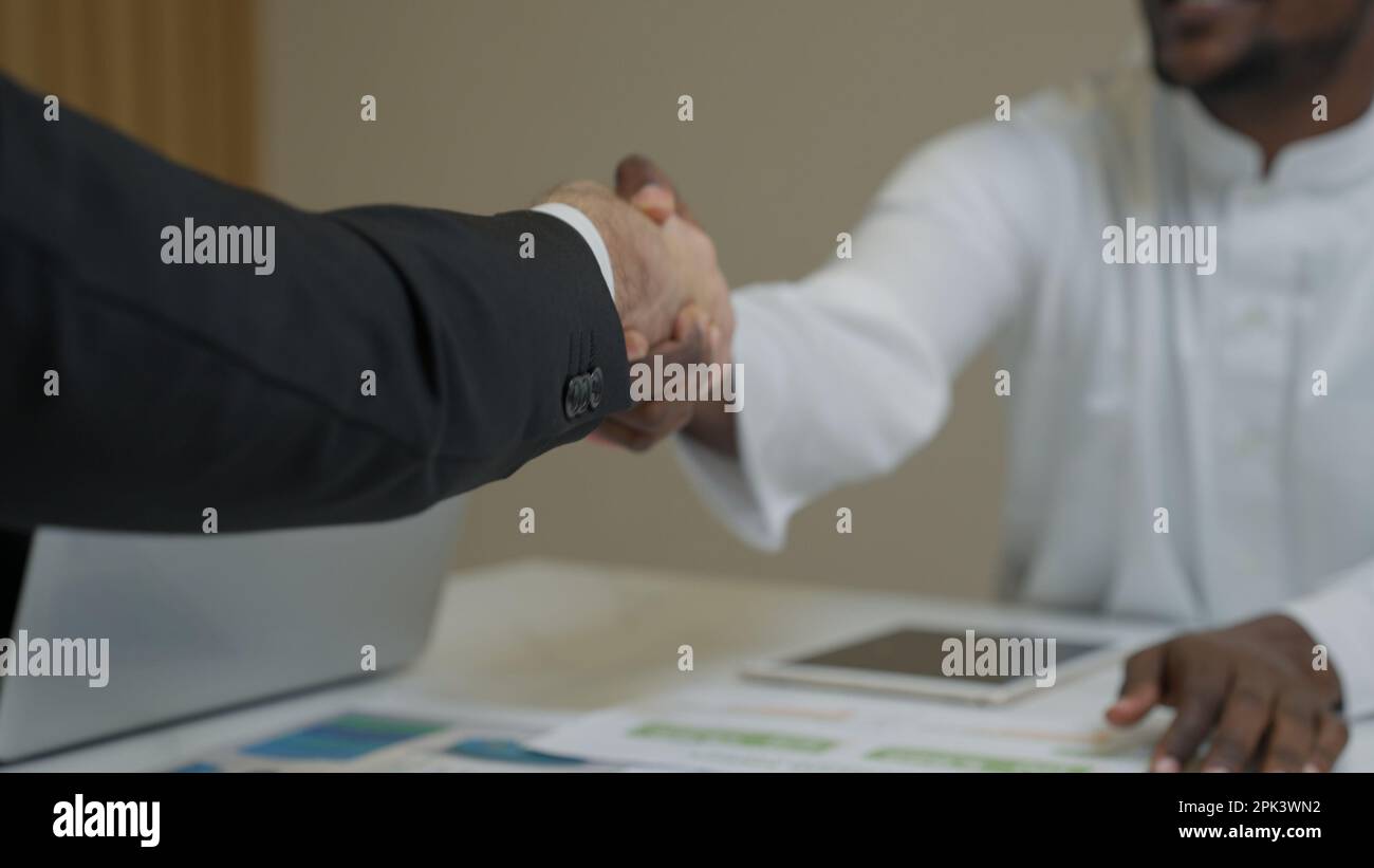 Businessmen shacking hands together showing successful contract ...
