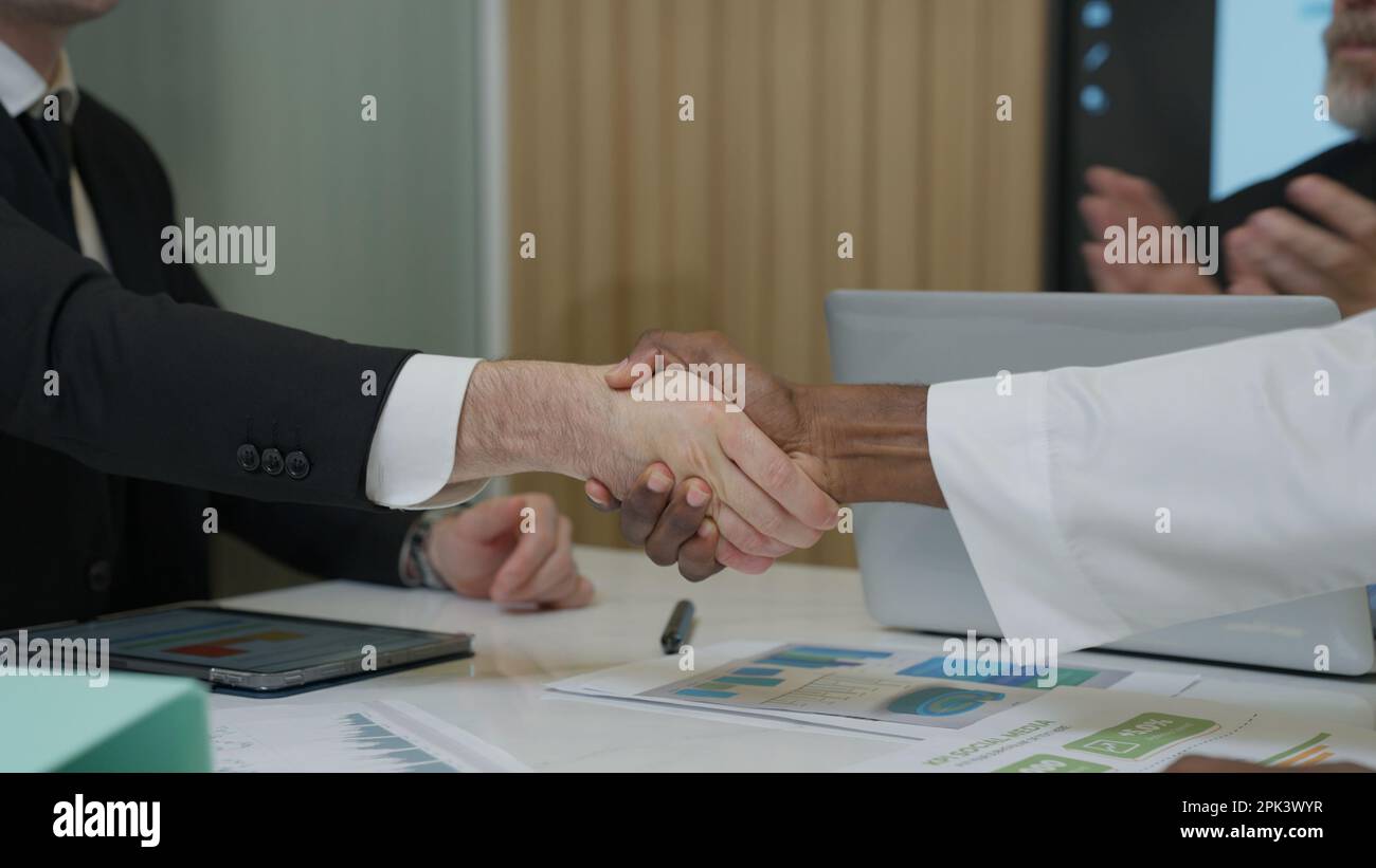 Businessmen shacking hands together showing successful contract ...
