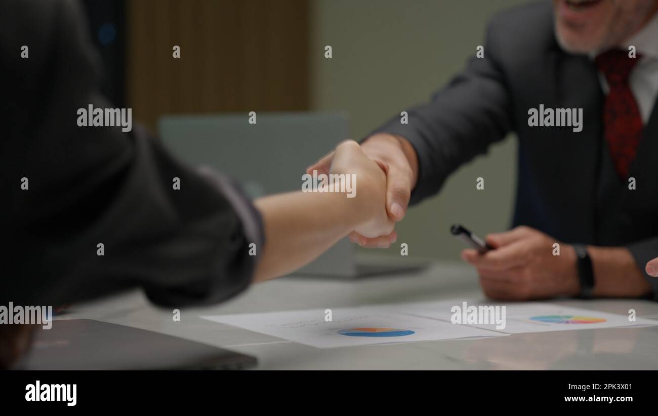 Businessmen shacking hands together showing successful contract ...