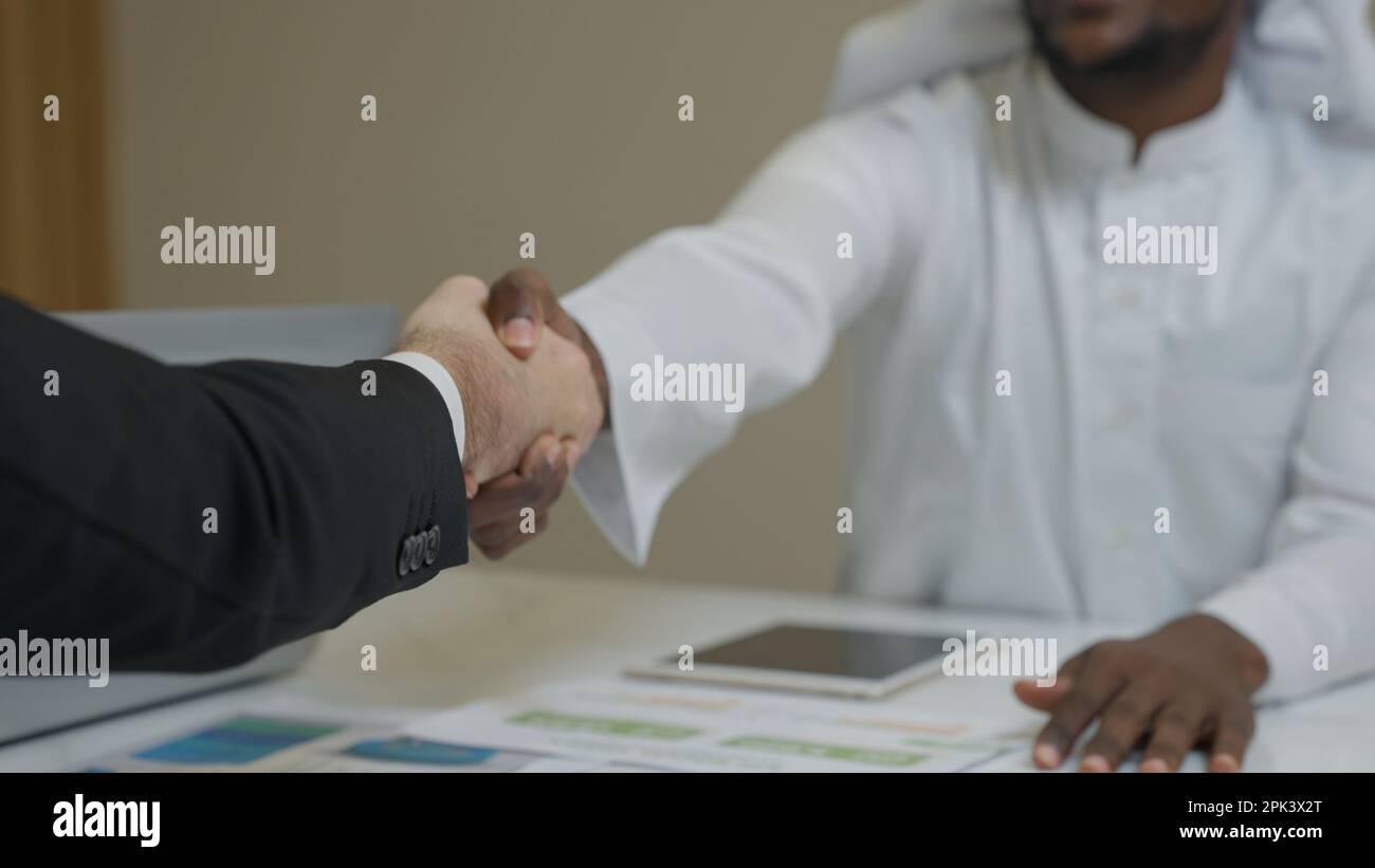 Businessmen shacking hands together showing successful contract ...