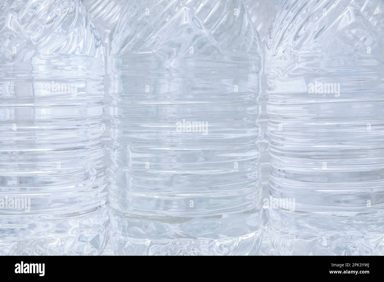 Water in plastic bottles closeup, background Stock Photo - Alamy