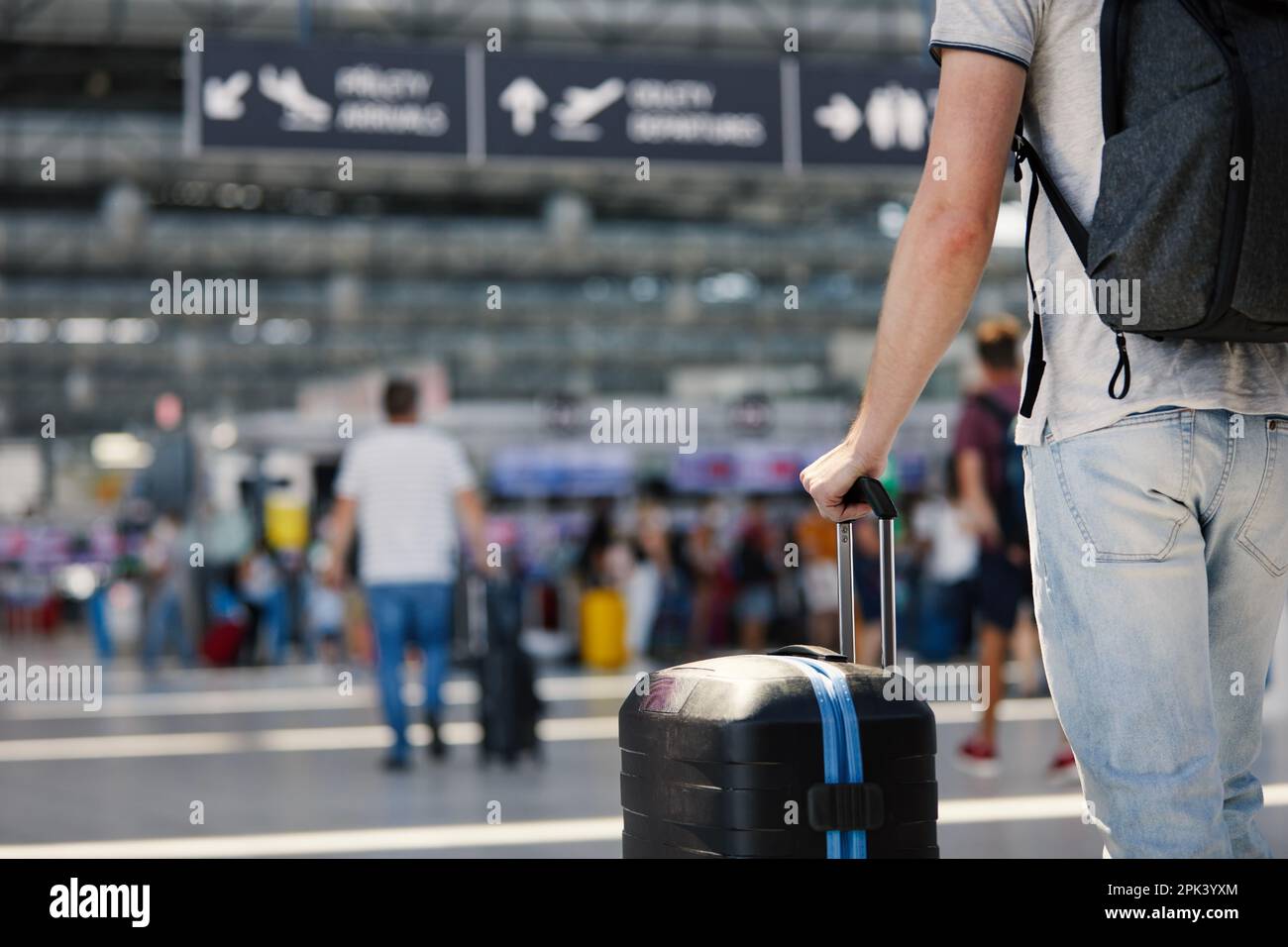 Traveling by airplane. Selective focus on hand of man holding suitcase ...