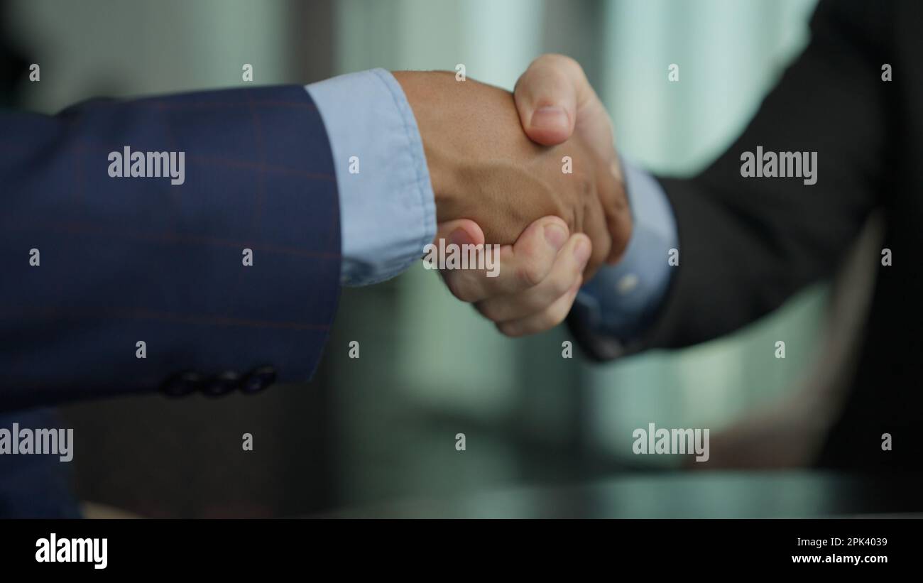 Business people shacking hands together showing successful contract ...