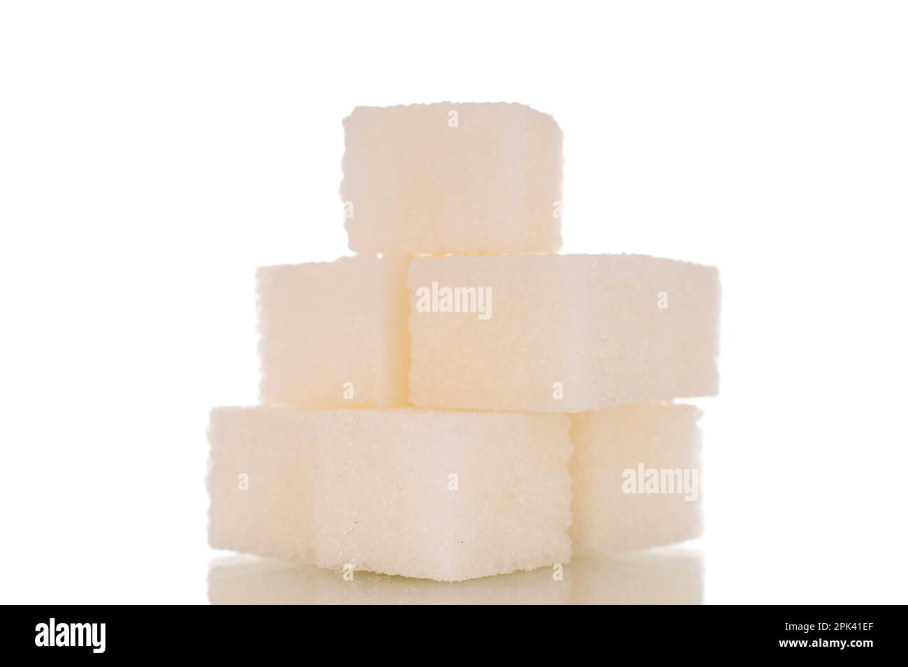 Several cubes of white sugar, macro, isolated on a white background ...
