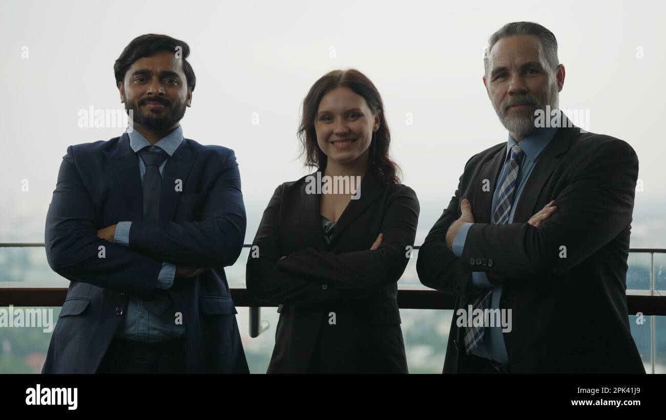 Professional business team crossing arms hi-res stock photography and ...