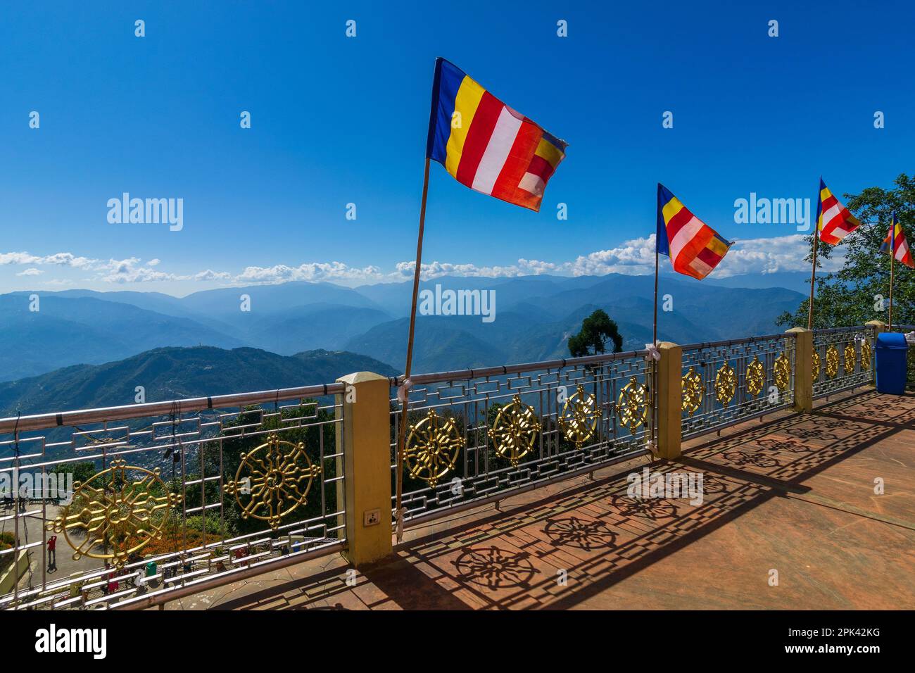Colourful Buddhist Prayer flags are waving in strong wind under ...