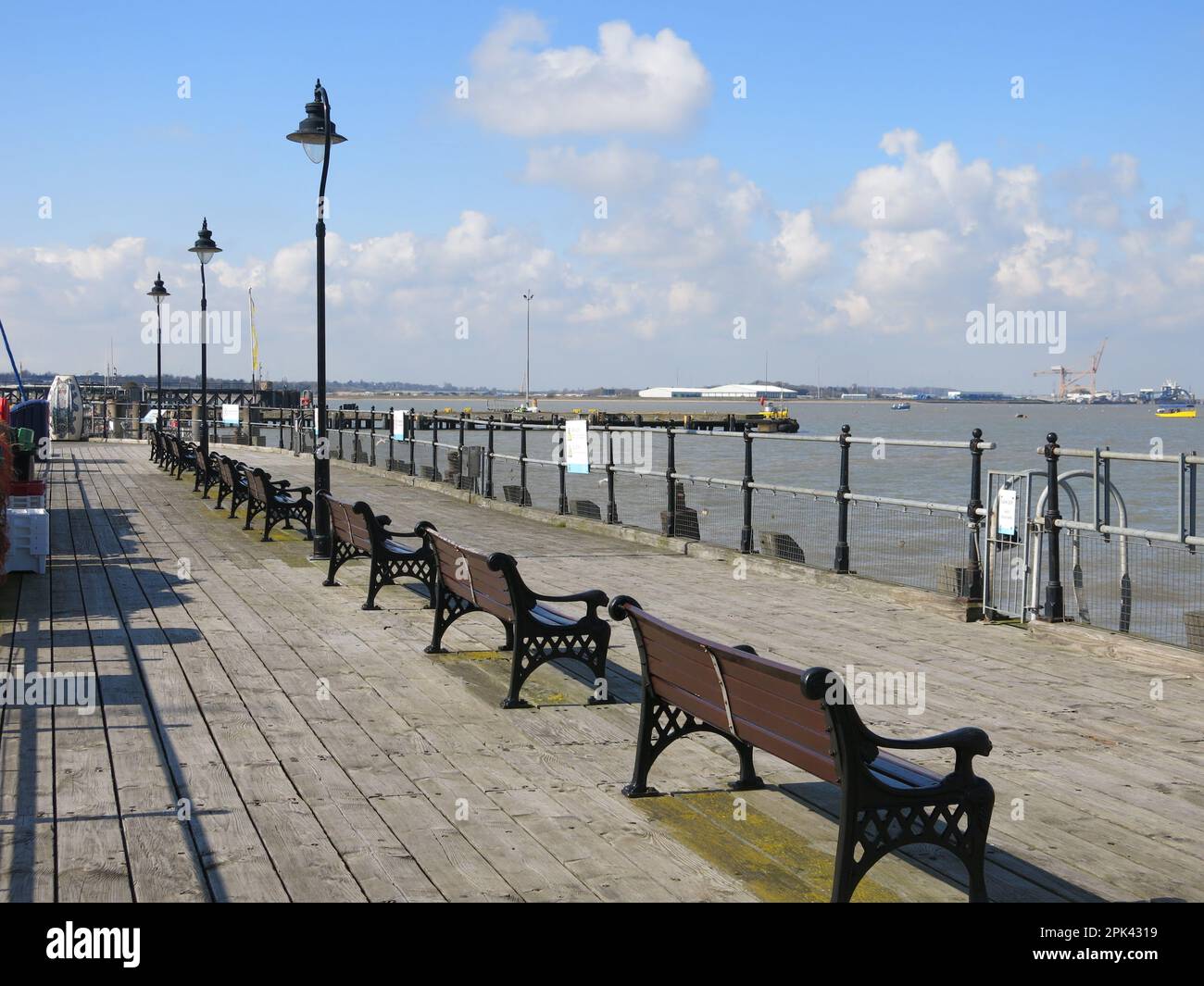 A row of benches on Ha'penny Pier in Harwich, one of the oldest ...