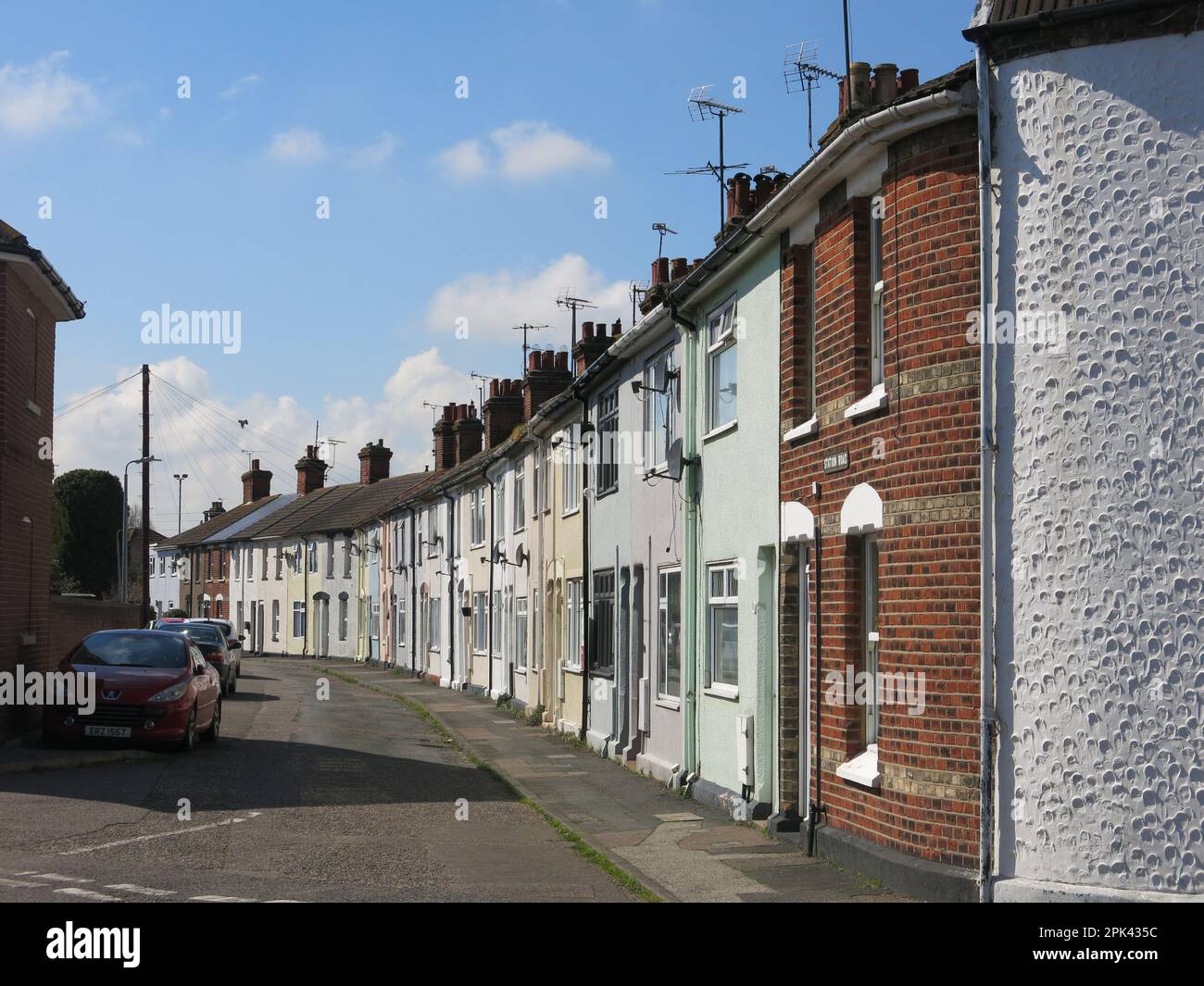 Station Road, Harwich: a curved row of terraced housing in a variety of ...