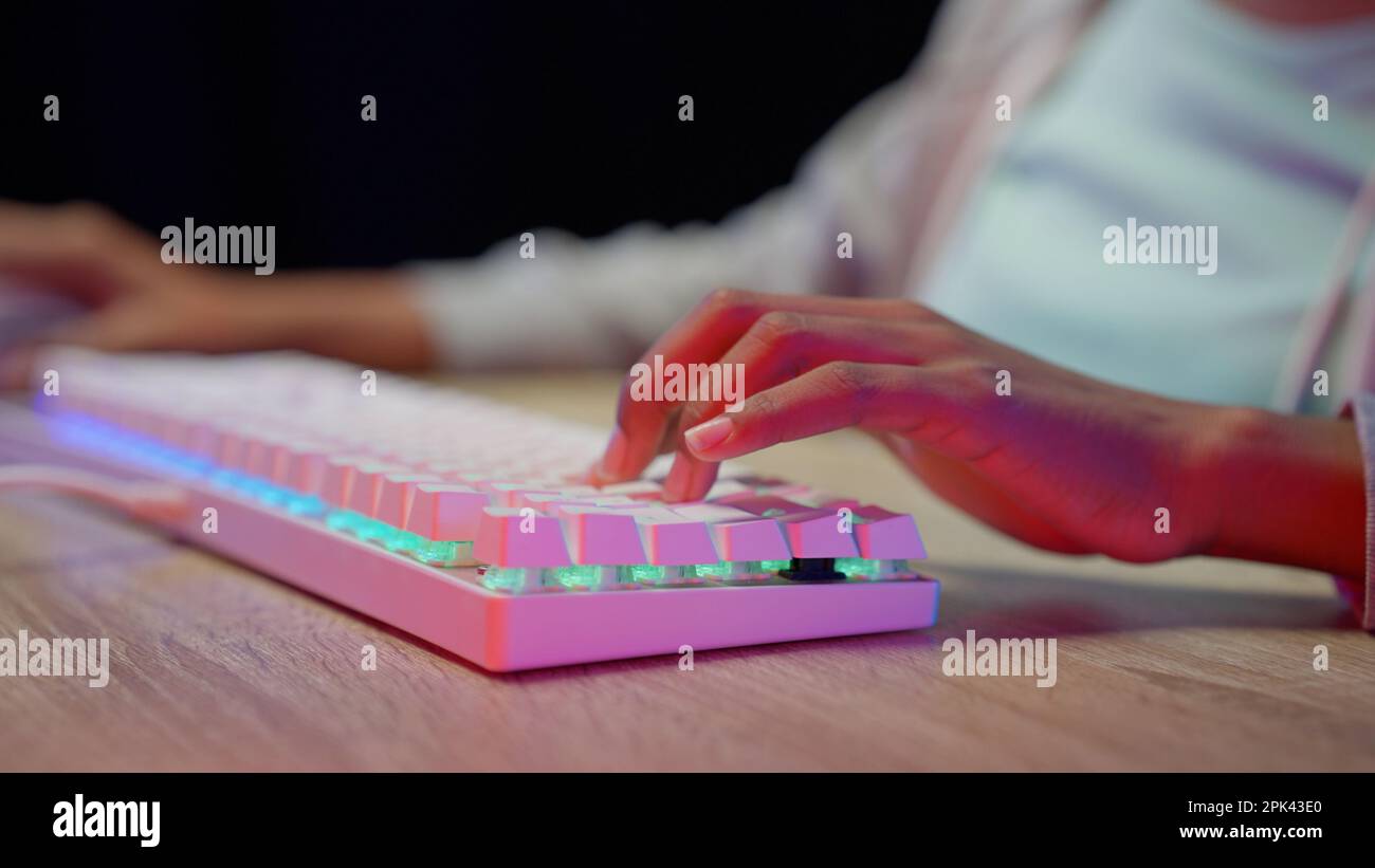 Game streamer using pc setup playing multiplayer first person shooter ...