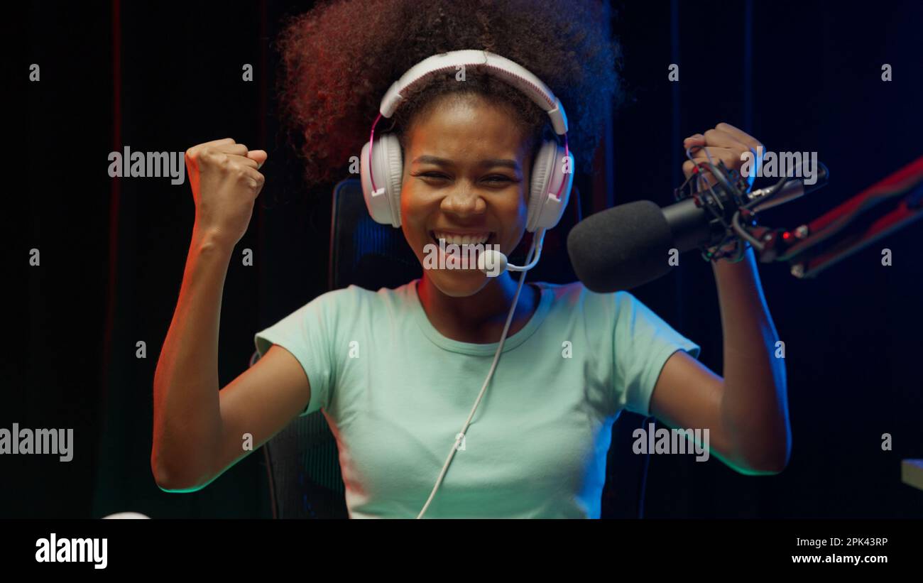 Game streamer using pc setup playing multiplayer first person shooter ...